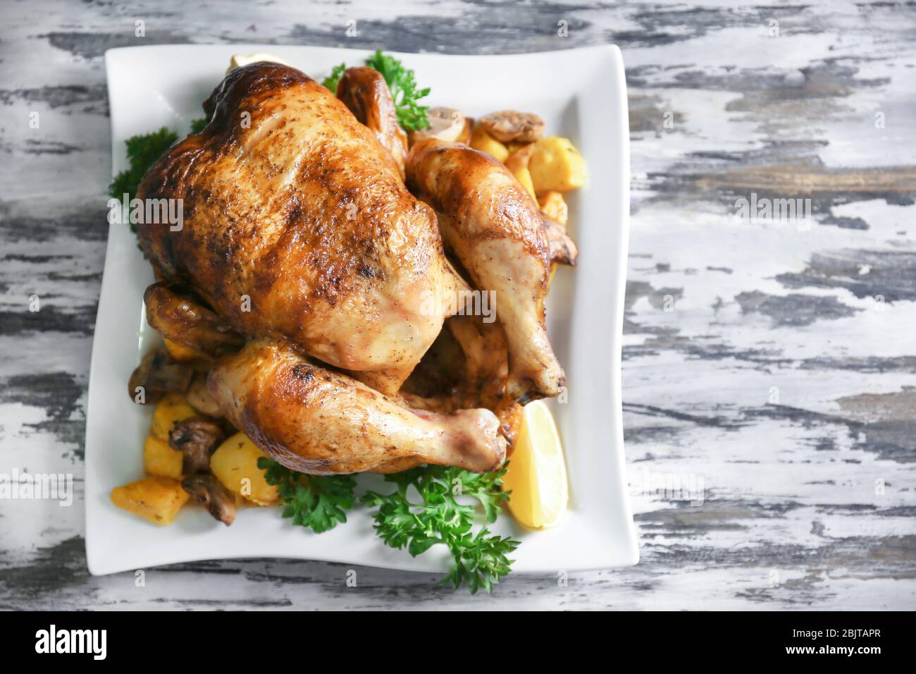 Grilled whole chicken side view hi-res stock photography and images - Alamy