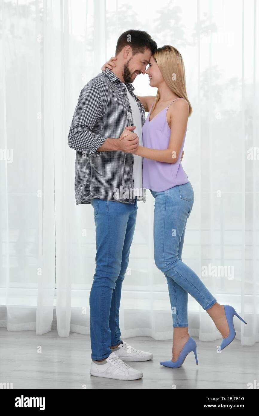 Happy couple dancing at home Stock Photo - Alamy
