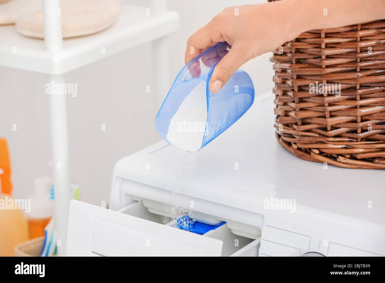 Adding detergent hi-res stock photography and images - Alamy