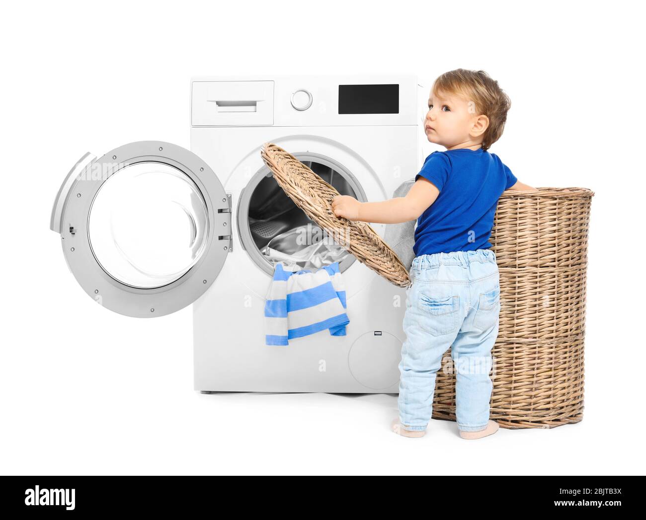Cute little boy doing laundry on white background Stock Photo - Alamy