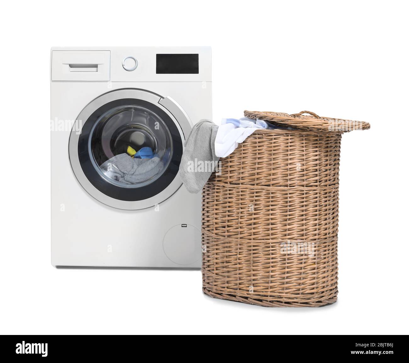 Washing machine and basket with laundry on white background Stock Photo ...