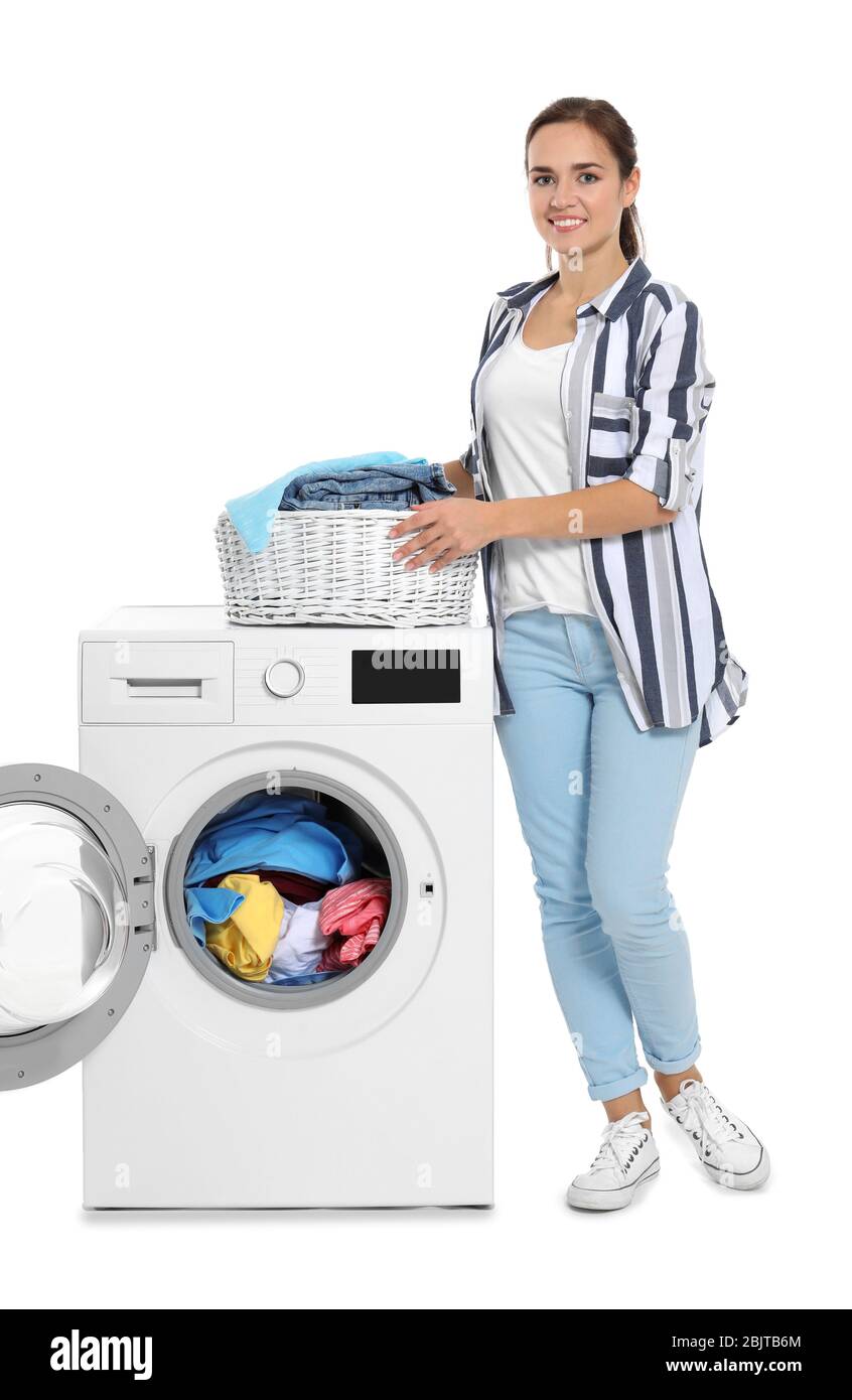 Person loading washing machine Cut Out Stock Images & Pictures - Alamy