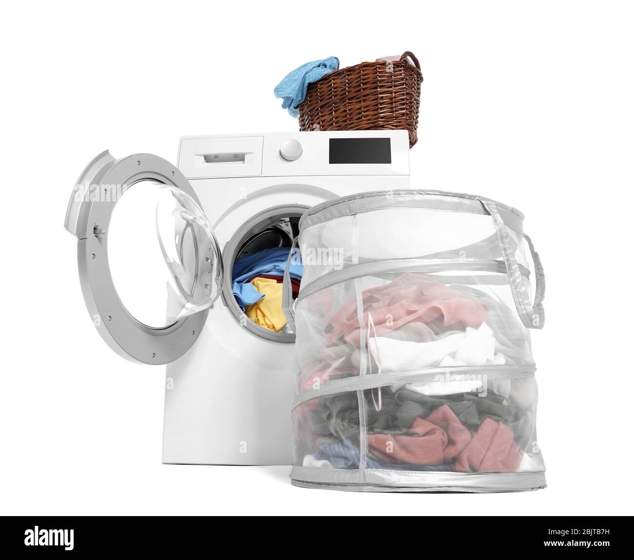Washing machine and basket with laundry on white background Stock Photo ...
