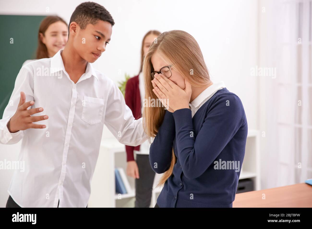 African American teen bullying his classmate in school Stock Photo - Alamy