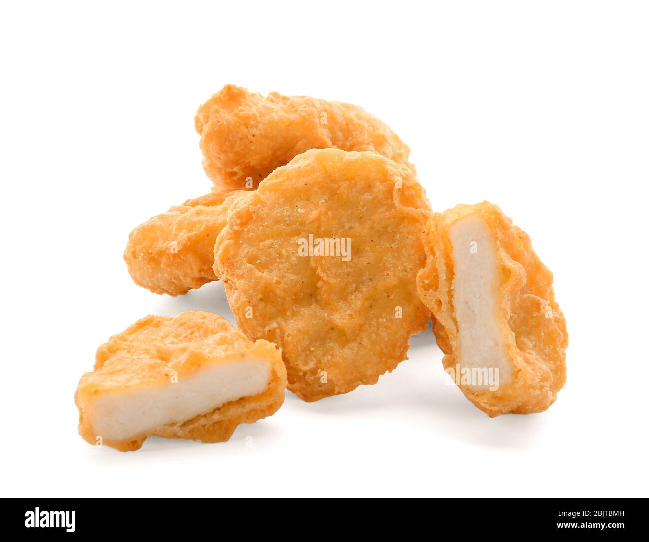 Tasty chicken nuggets on white background Stock Photo - Alamy