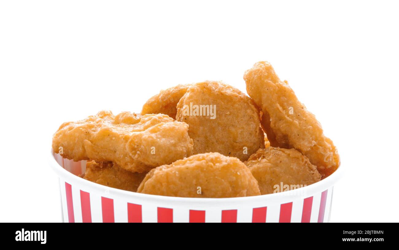 Paper cup with tasty chicken nuggets on white background Stock Photo ...