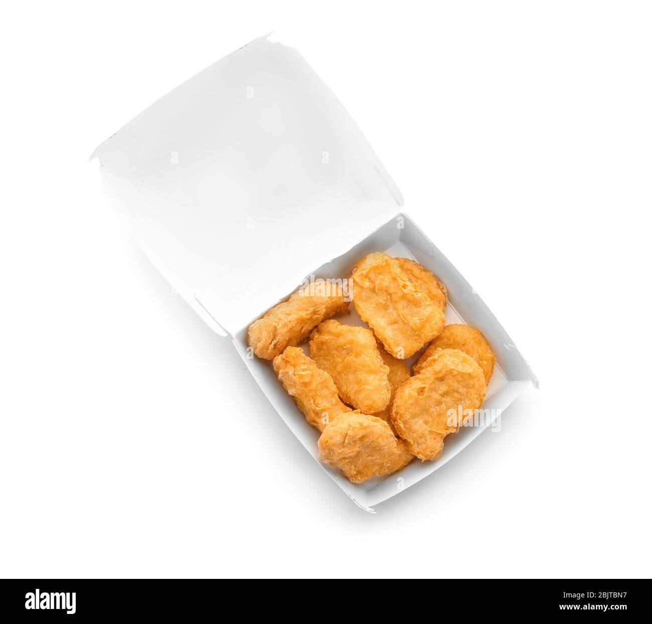 Box with tasty chicken nuggets on white background Stock Photo - Alamy