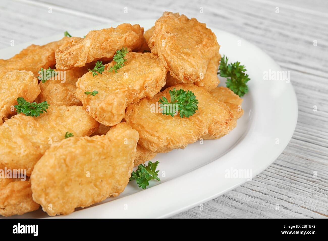 Many tasty chicken nuggets hi-res stock photography and images - Alamy