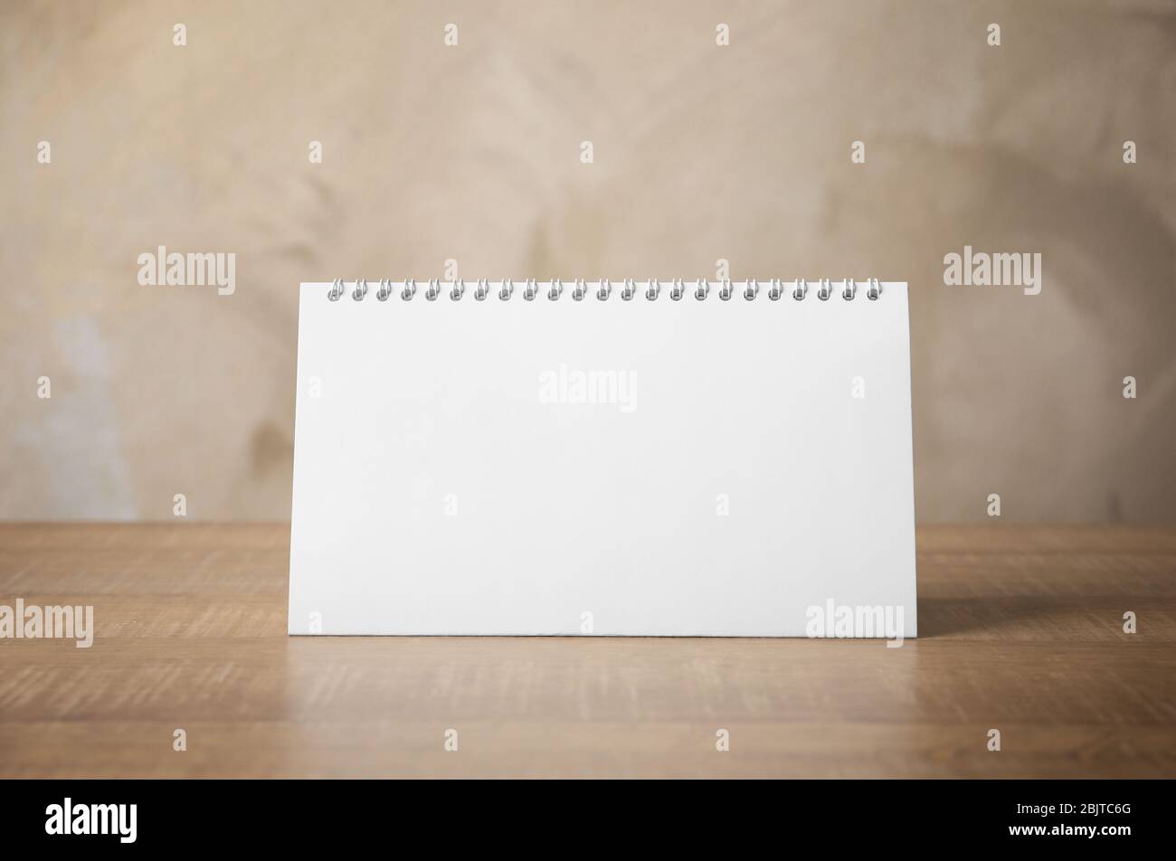 Blank desk calendar on table. Mockup for design Stock Photo - Alamy