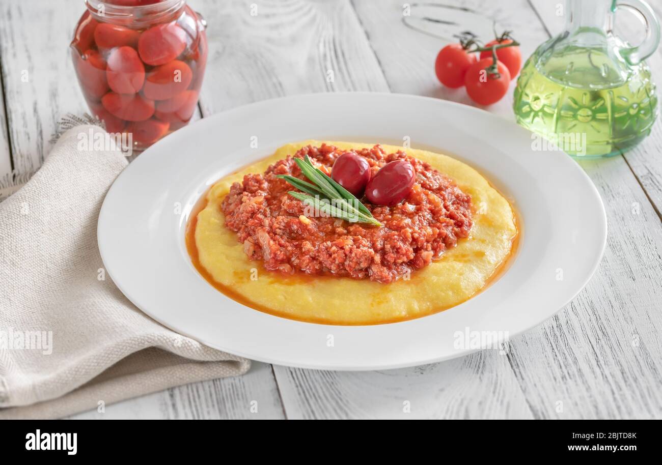 Italian cornmeal polenta with bolognese sauce Stock Photo - Alamy