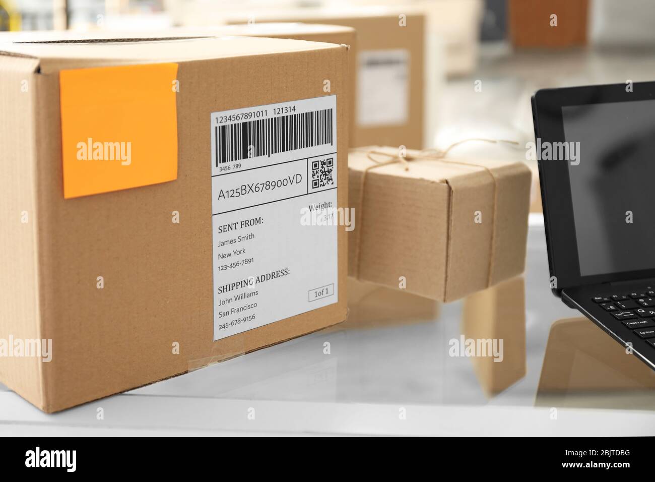 Parcels ready for shipment to customers on table in home office ...