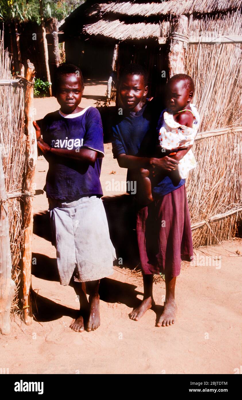 Sudanese family at entrance to village near Yei, Republic of South ...