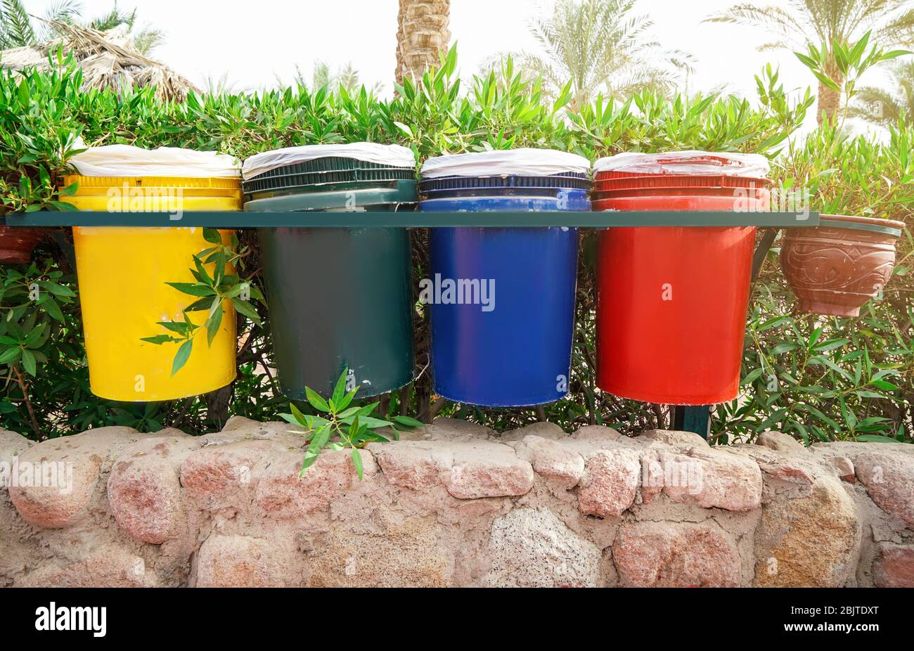 Different dustbins with trash outdoors. Recycling concept Stock Photo ...