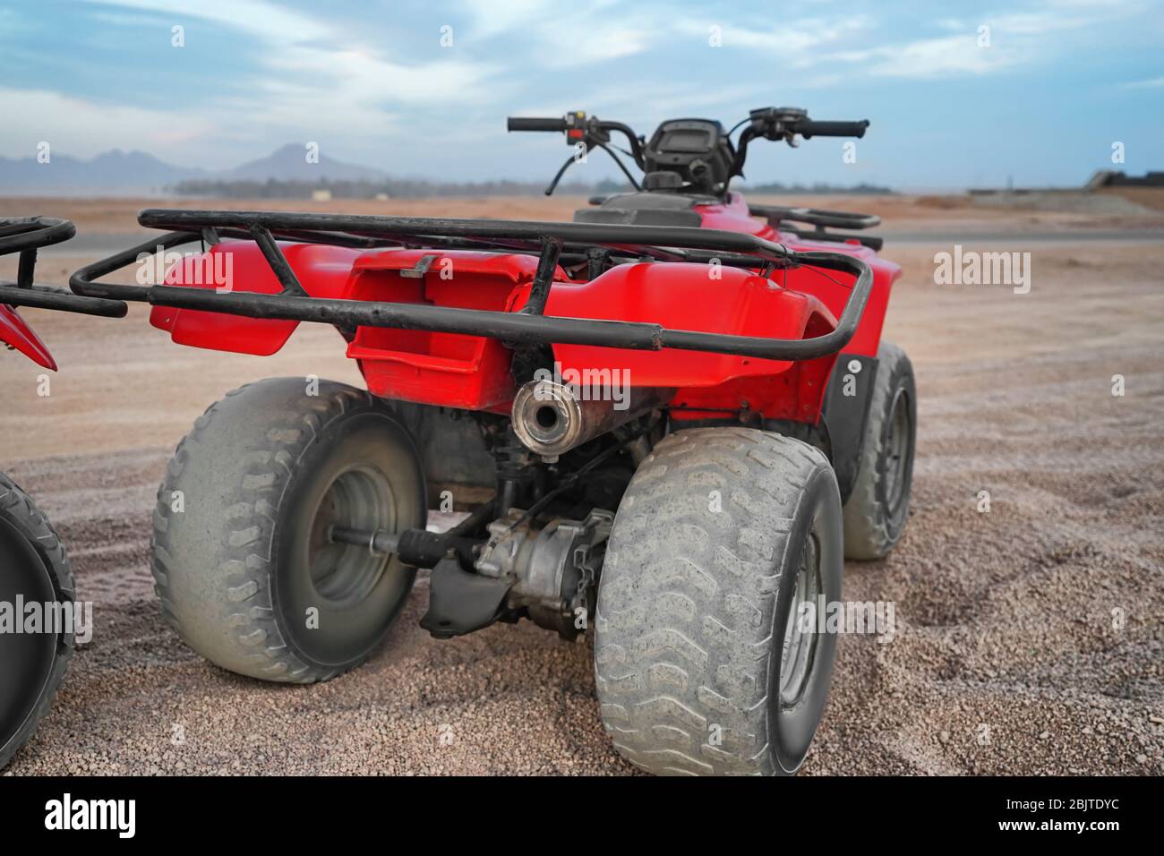 Modern quad bike in desert Stock Photo - Alamy