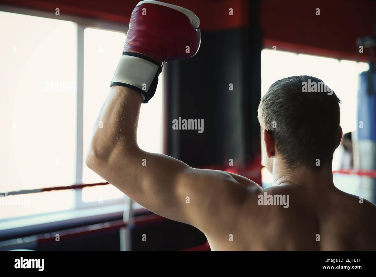 Young man in boxing ring Stock Photo - Alamy