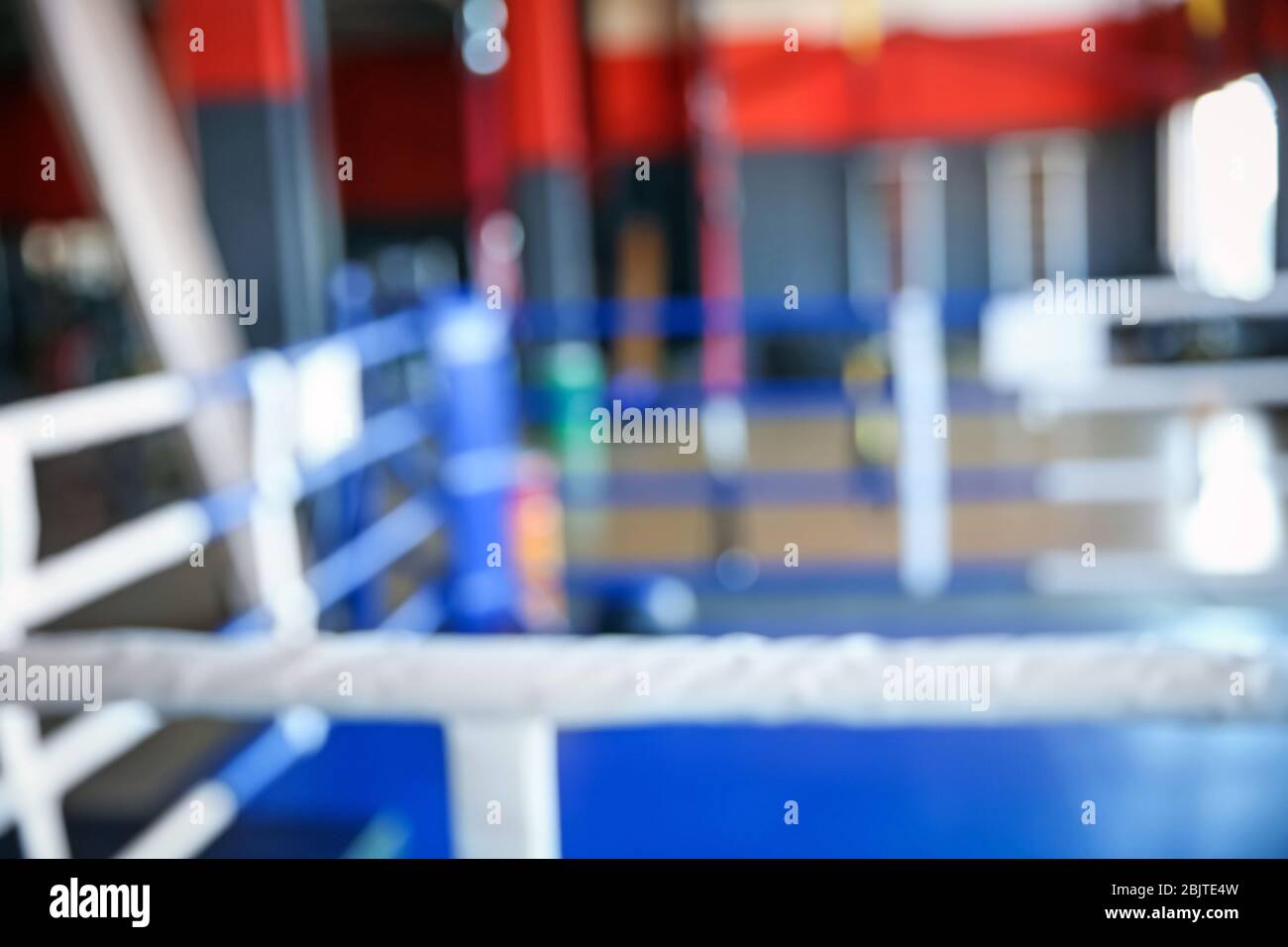 Blurred view of empty boxing ring in gym Stock Photo - Alamy