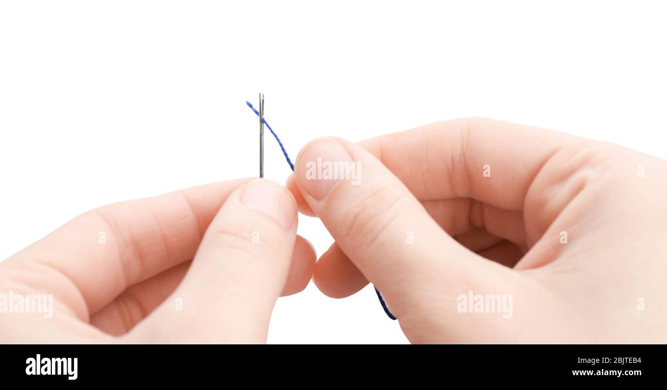 Woman threading needle on white background, closeup Stock Photo - Alamy