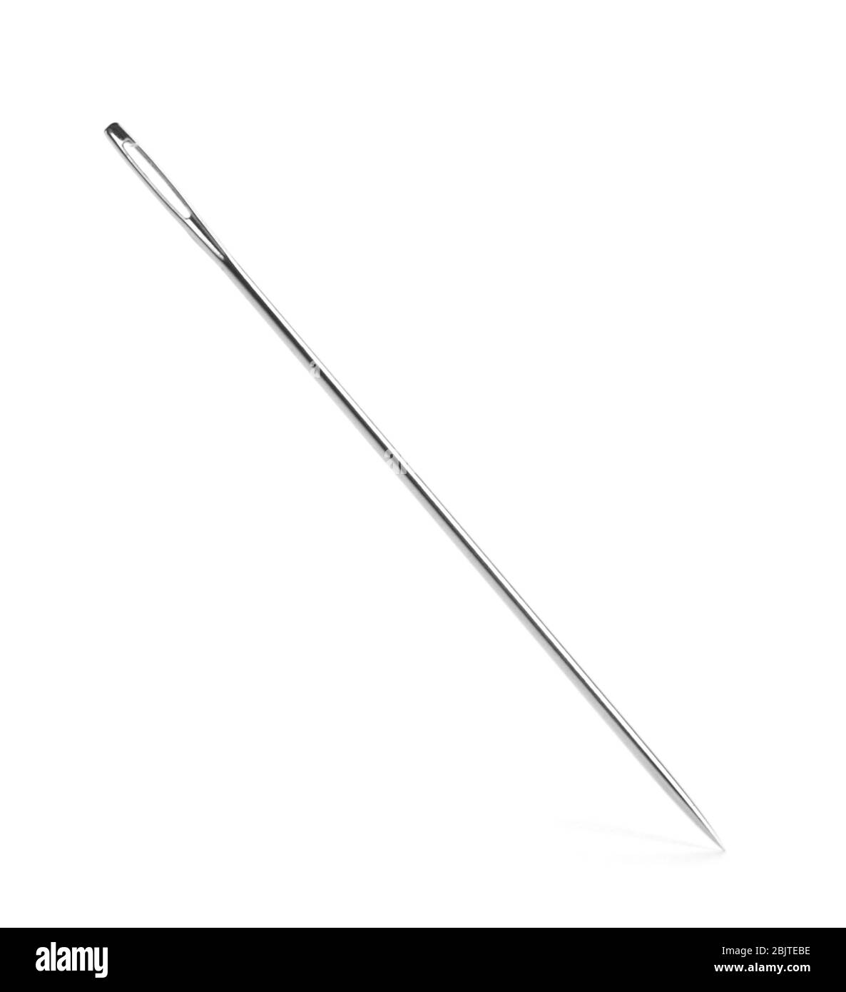 Sewing needle on white background Stock Photo - Alamy
