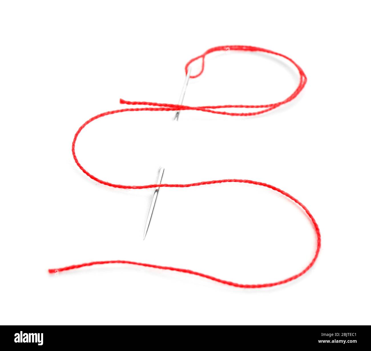 Needle with sewing thread on white background Stock Photo - Alamy