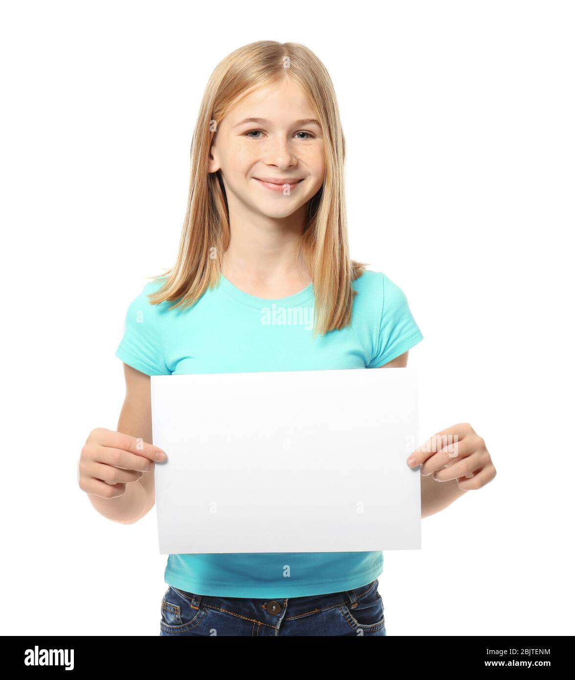 Cute girl with blank sheet of paper for advertising on white background ...
