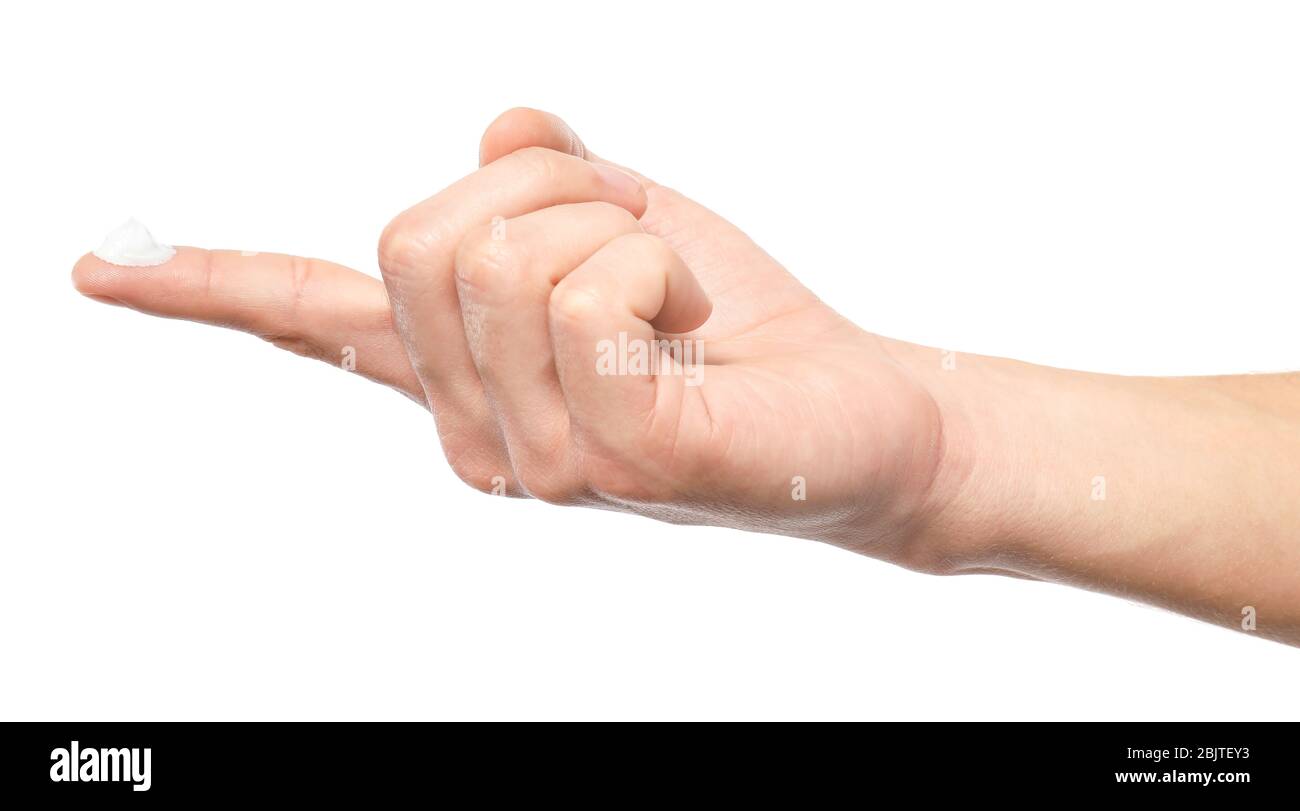 Hand of man with cream on finger against white background Stock Photo ...