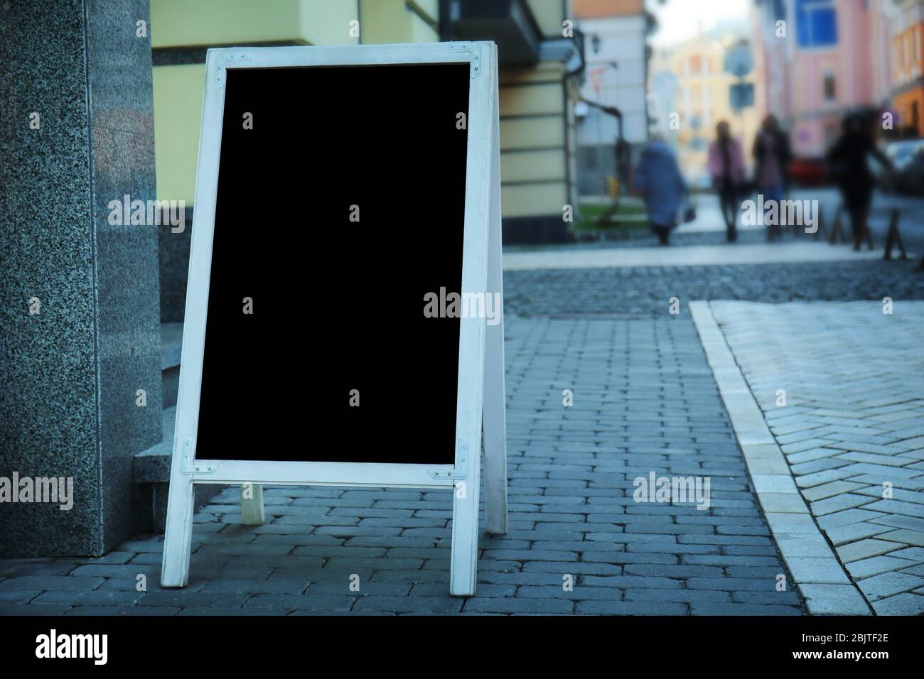 Blank advertising board on city street Stock Photo - Alamy
