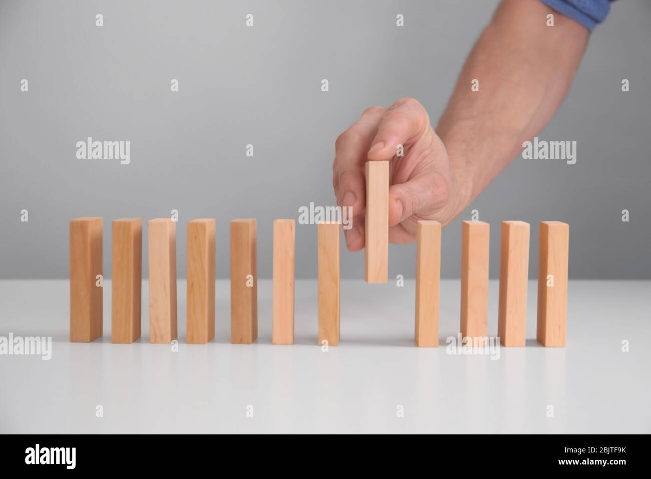 Man putting wooden blocks hi-res stock photography and images - Alamy