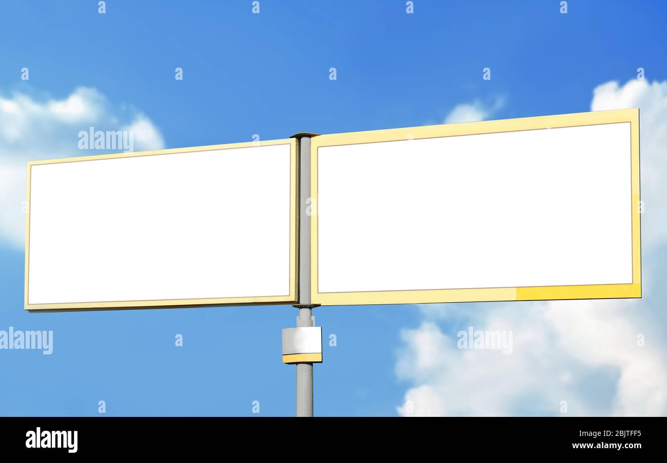 Blank advertising boards on blue sky background Stock Photo - Alamy