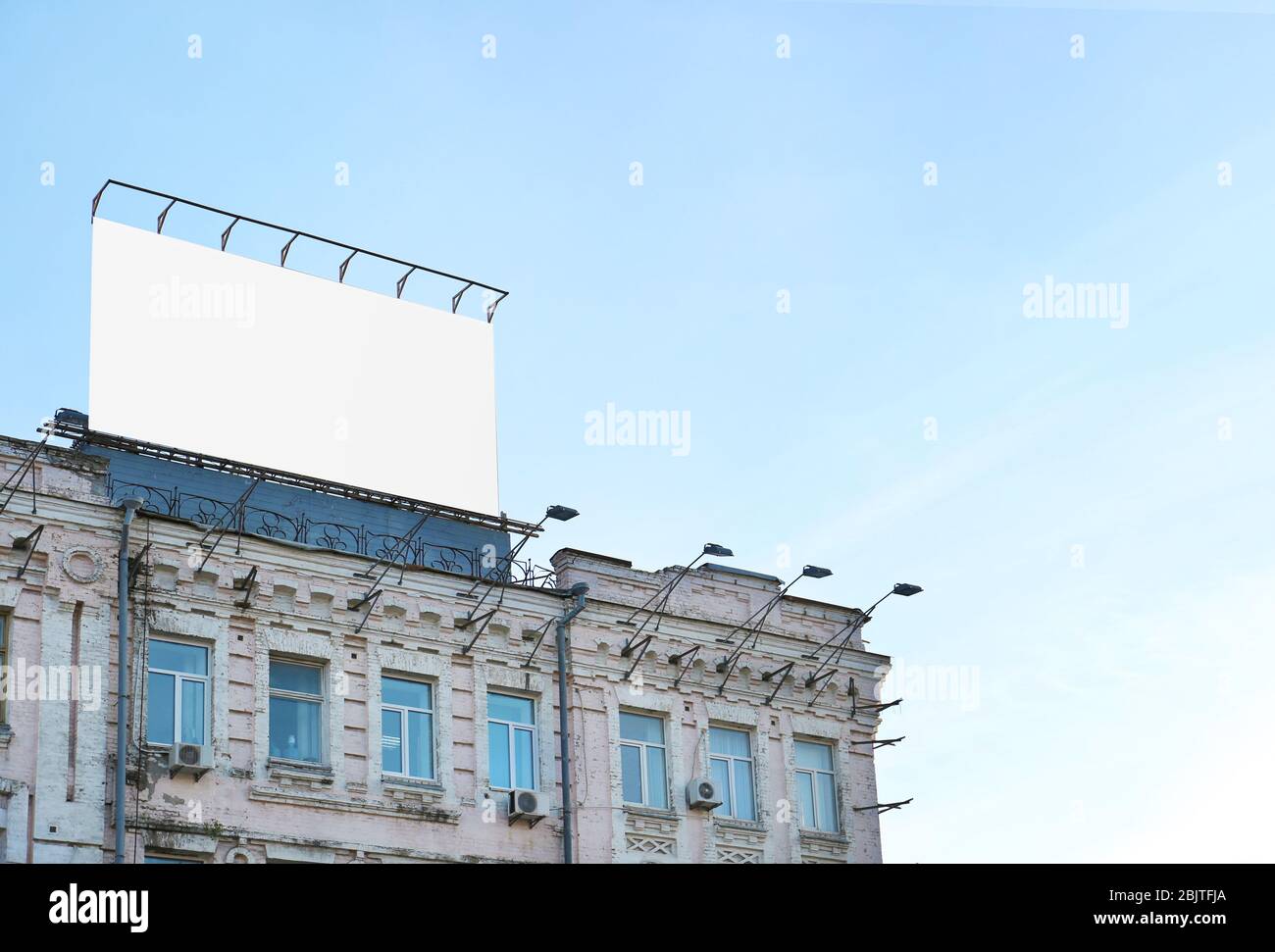 Blank advertising board on city building outdoors Stock Photo - Alamy
