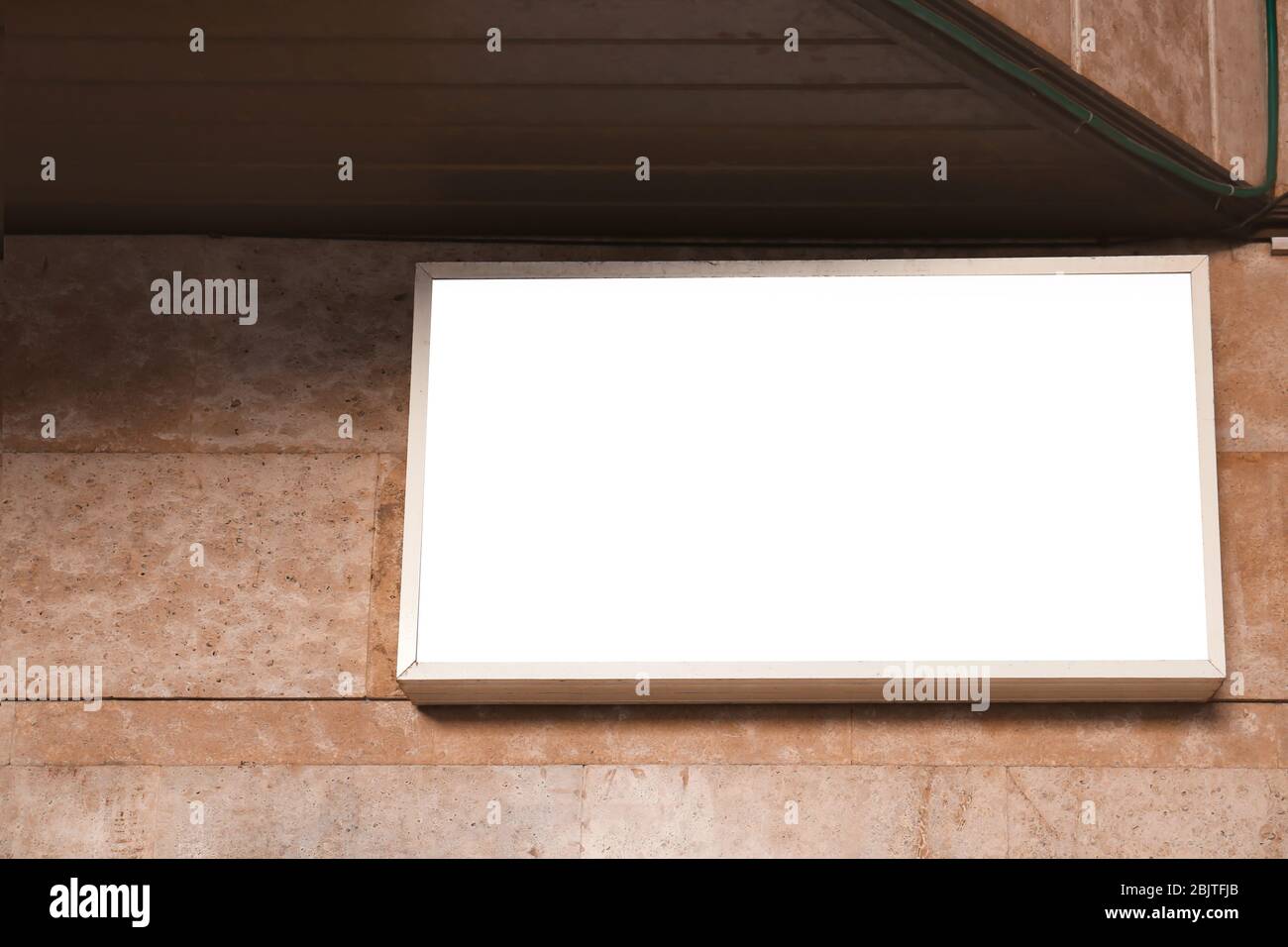 Blank advertising board on wall of building Stock Photo - Alamy