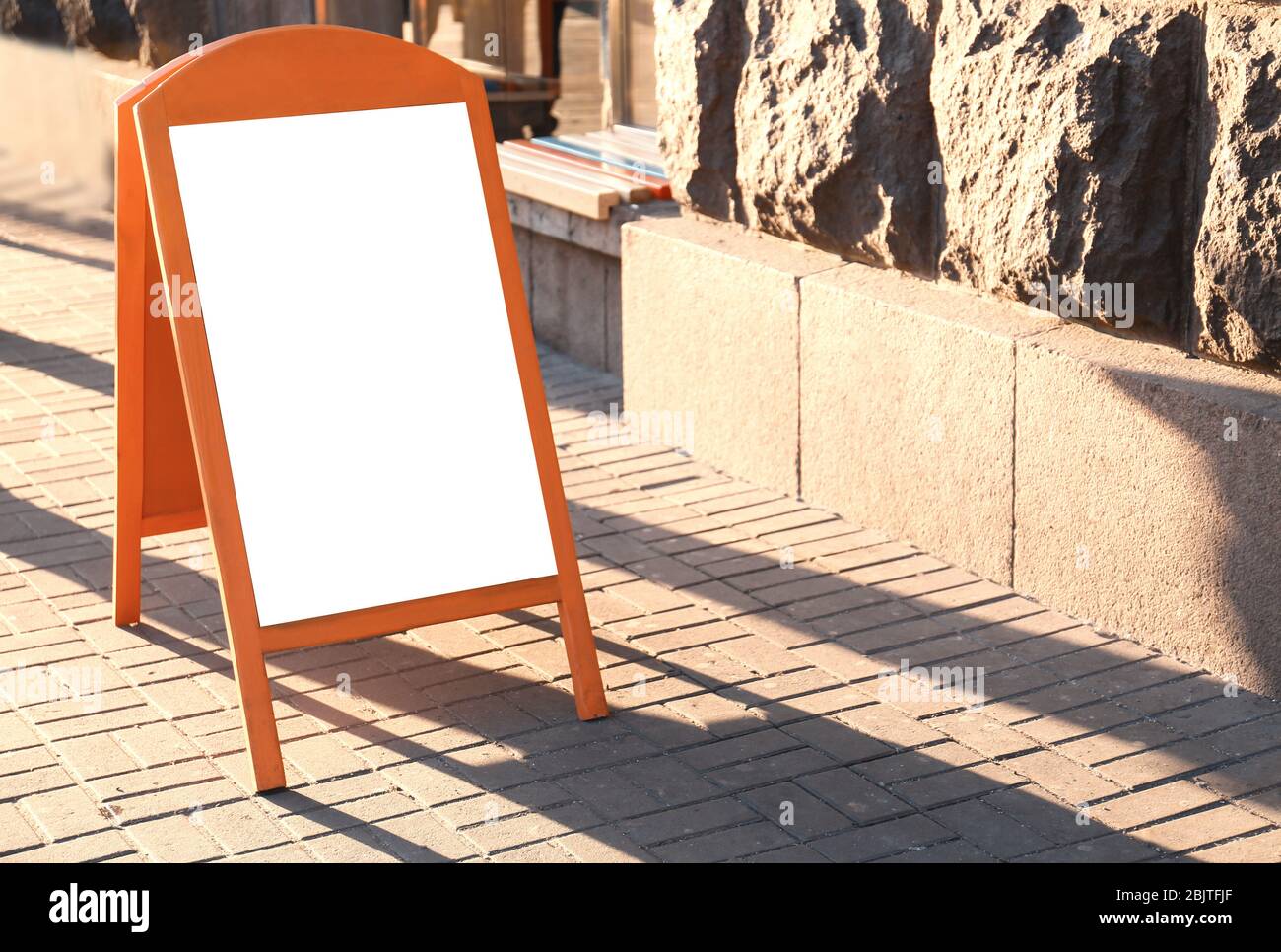 Blank advertising board on city street Stock Photo - Alamy