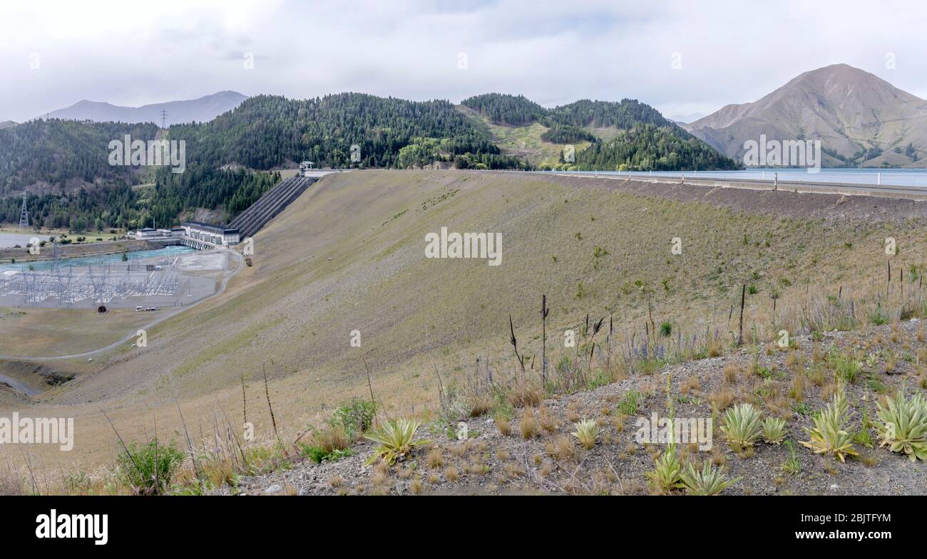 landscape with Benmore lake soil dam and energy plant , shot in bright ...