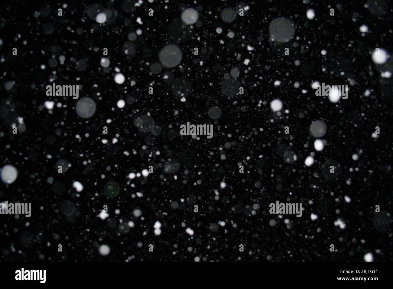 Photo of a dense snow falling at night, beautiful background Stock ...