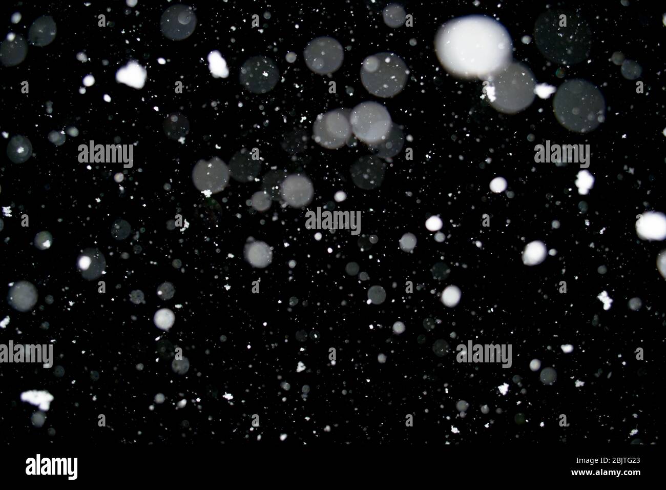 Beautiful snow falling on background hi-res stock photography and ...