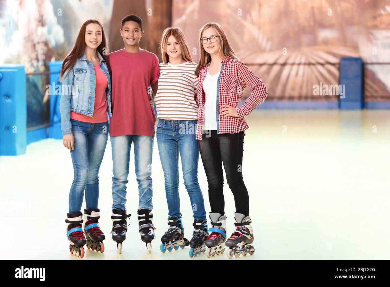 Group of teenagers at roller skating rink Stock Photo - Alamy