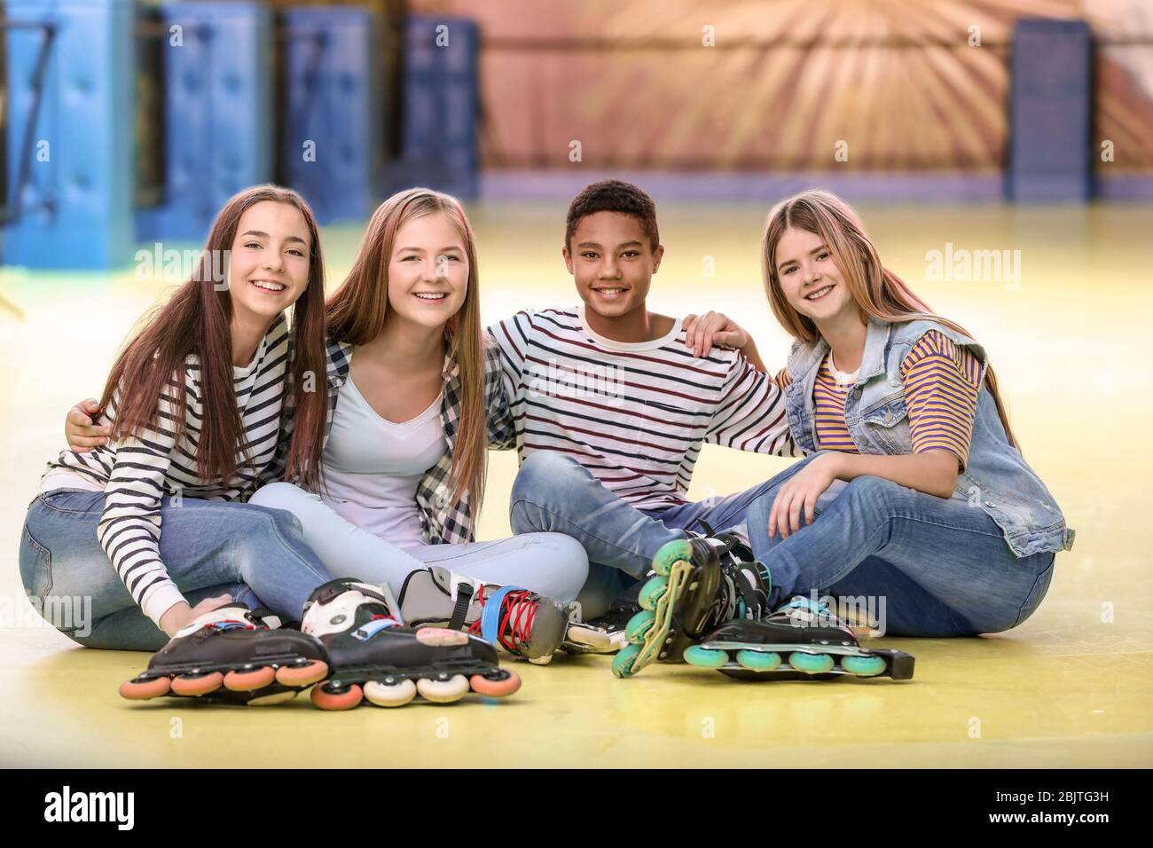 Group of teenagers at roller skating rink Stock Photo - Alamy
