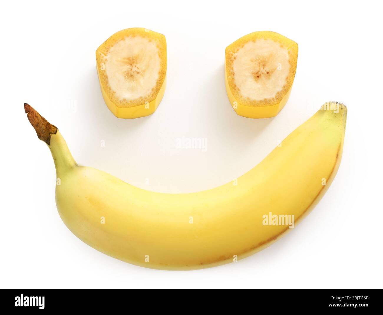 Smile made of bananas on white background Stock Photo - Alamy