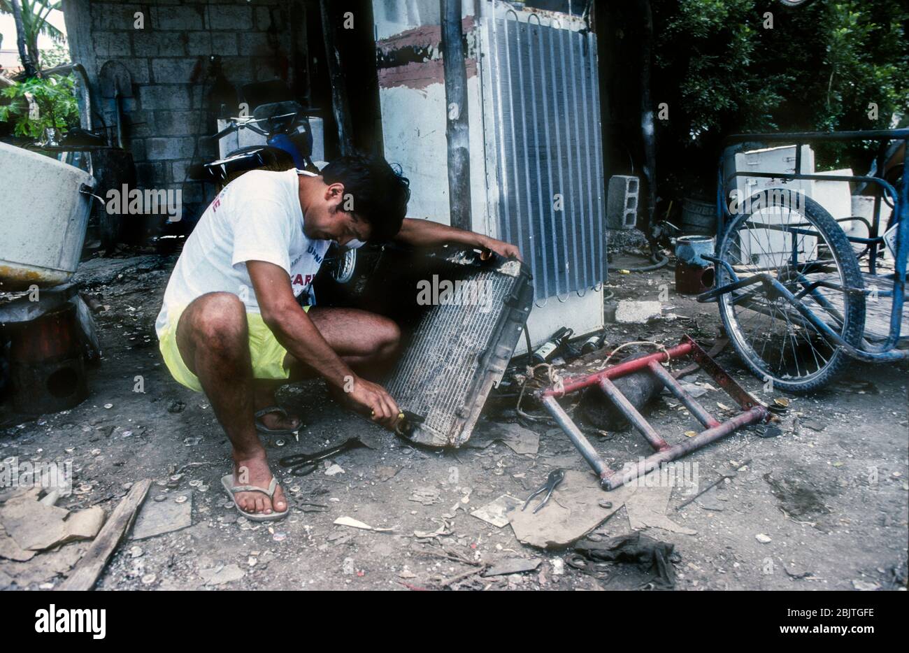 Man repairing car radiator hi-res stock photography and images - Alamy