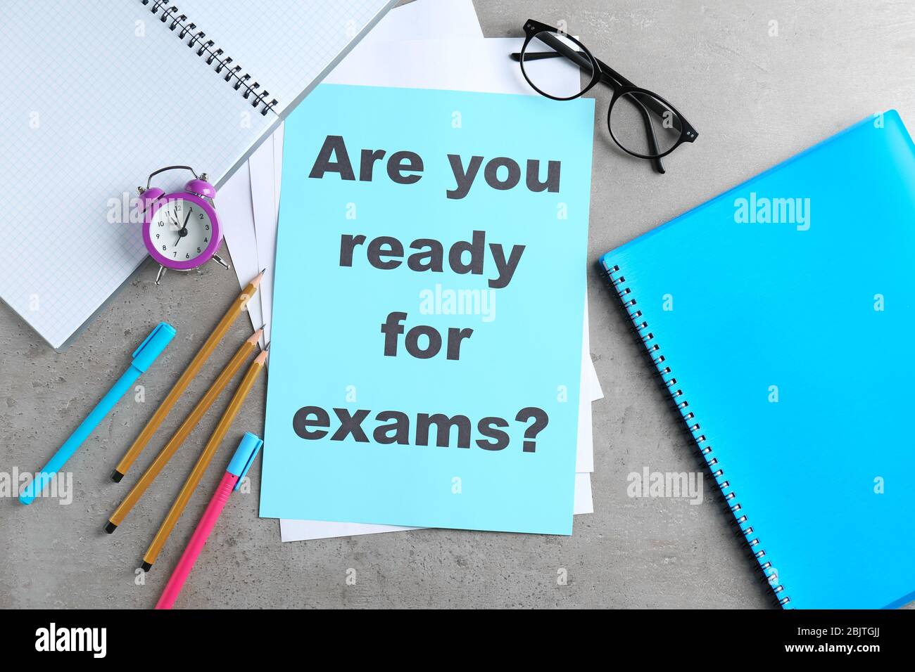 Paper with question "Are you ready for exams?" and stationery on table ...