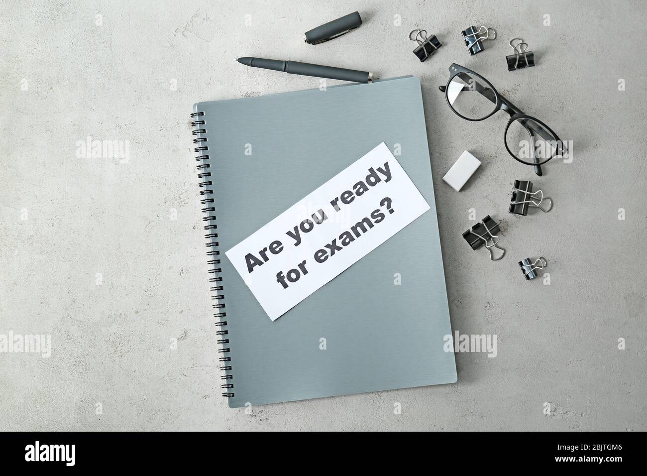 Paper with question "Are you ready for exams?" and stationery on grey ...