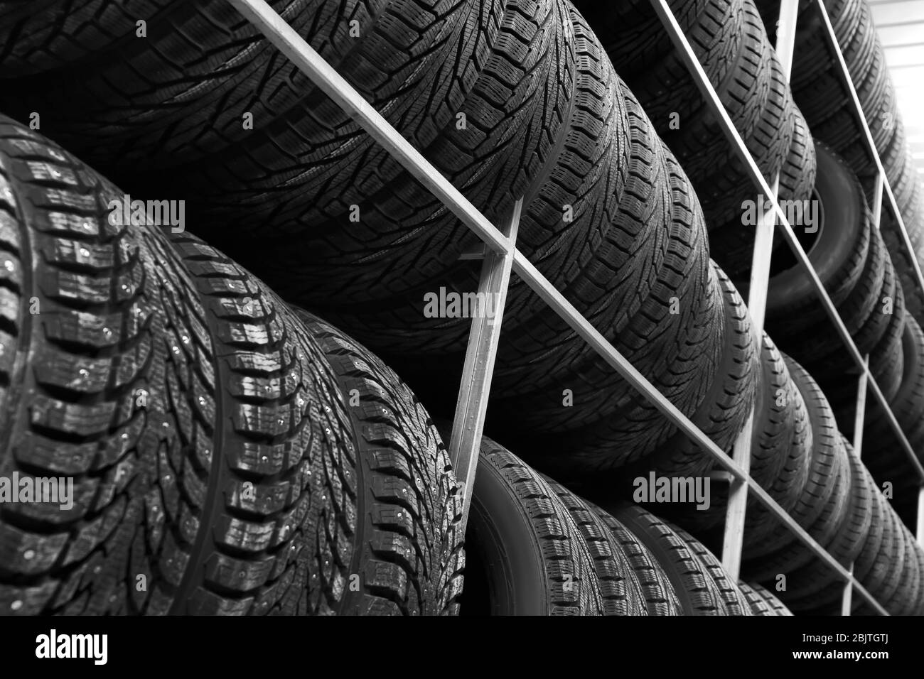Car tires rack Black and White Stock Photos & Images - Alamy