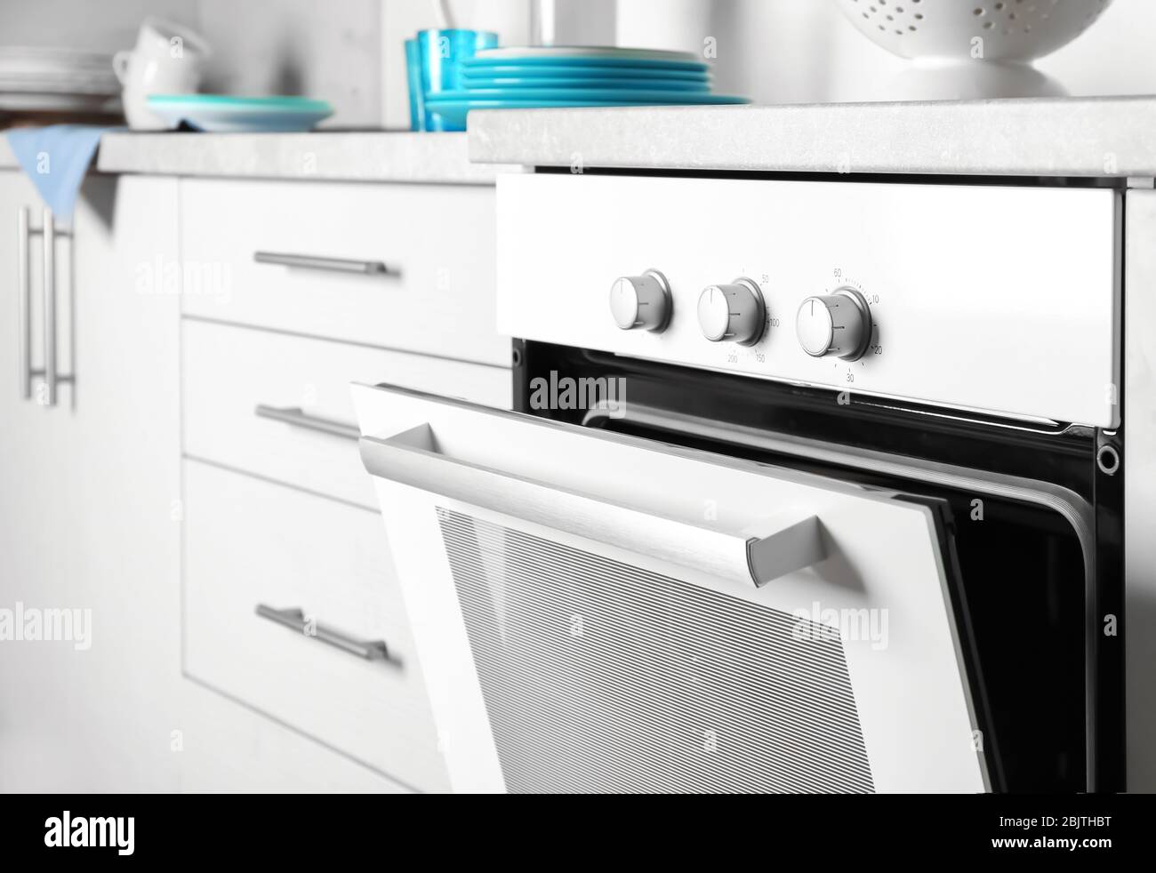 Modern electrical white oven in kitchen Stock Photo - Alamy