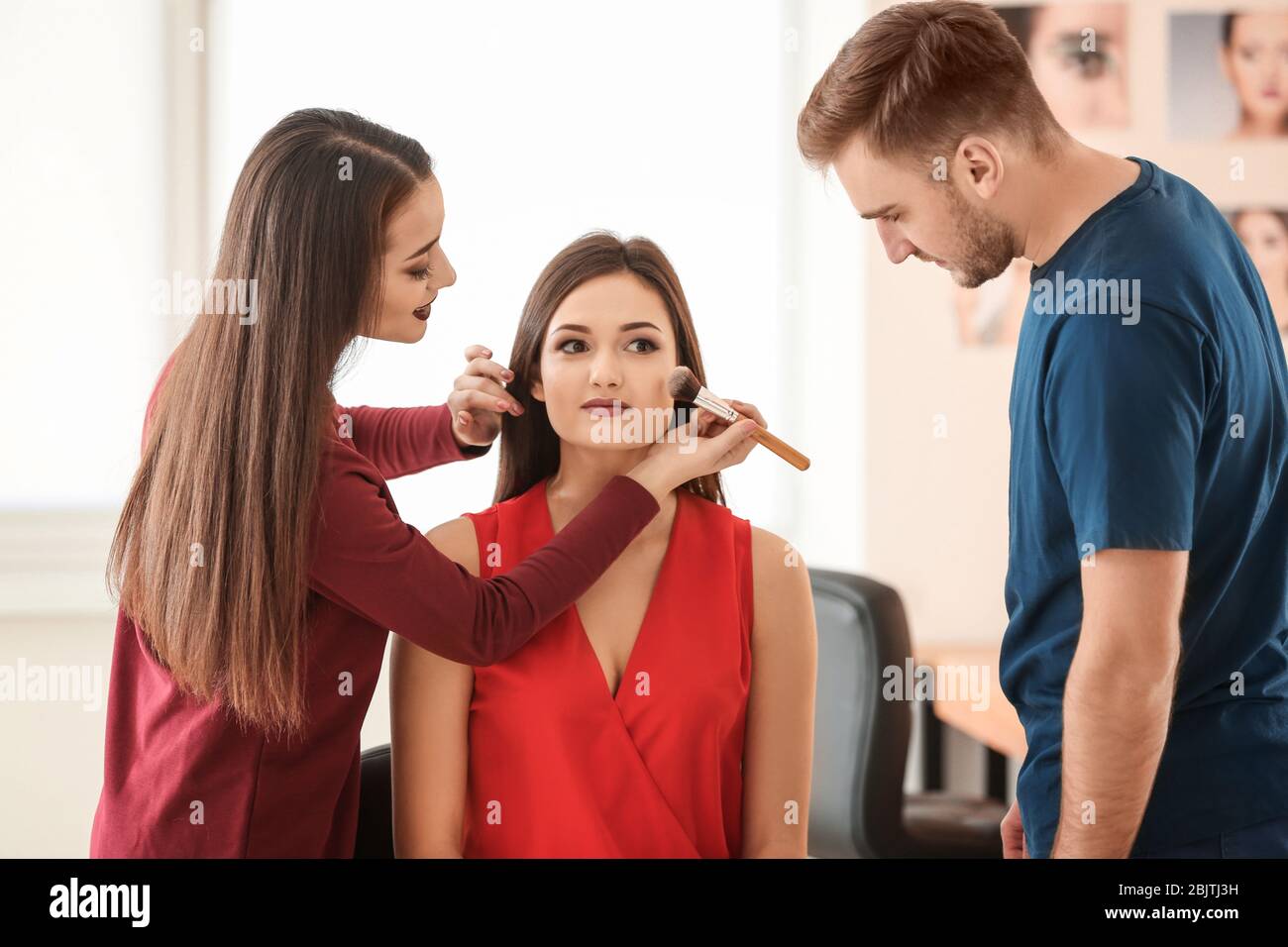 Professional makeup artist teaching trainee in salon. Apprenticeship ...