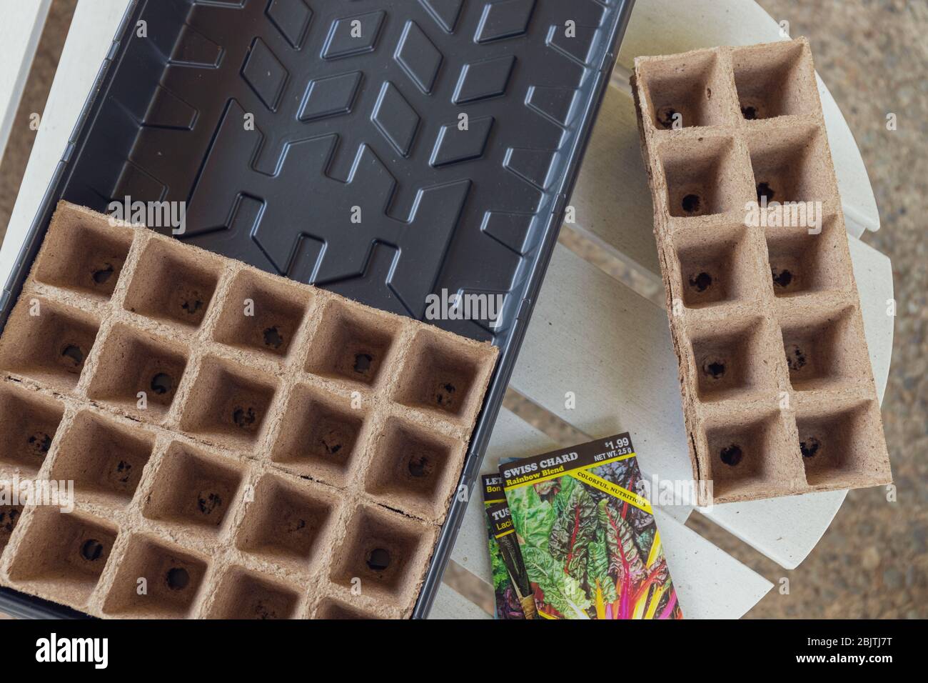 Empty Seed Starter Kit with Seed Packets on White Wood Table Stock ...