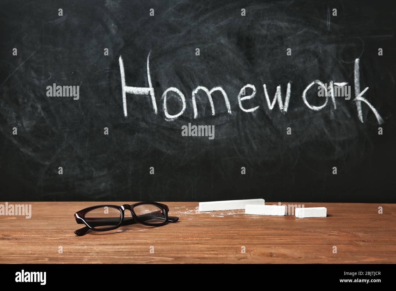 Word homework on glasses hi-res stock photography and images - Alamy