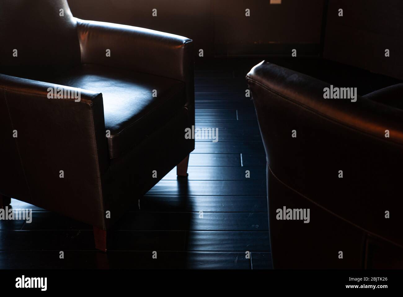 Dramatic dark lighting on comfortable office chair Stock Photo - Alamy