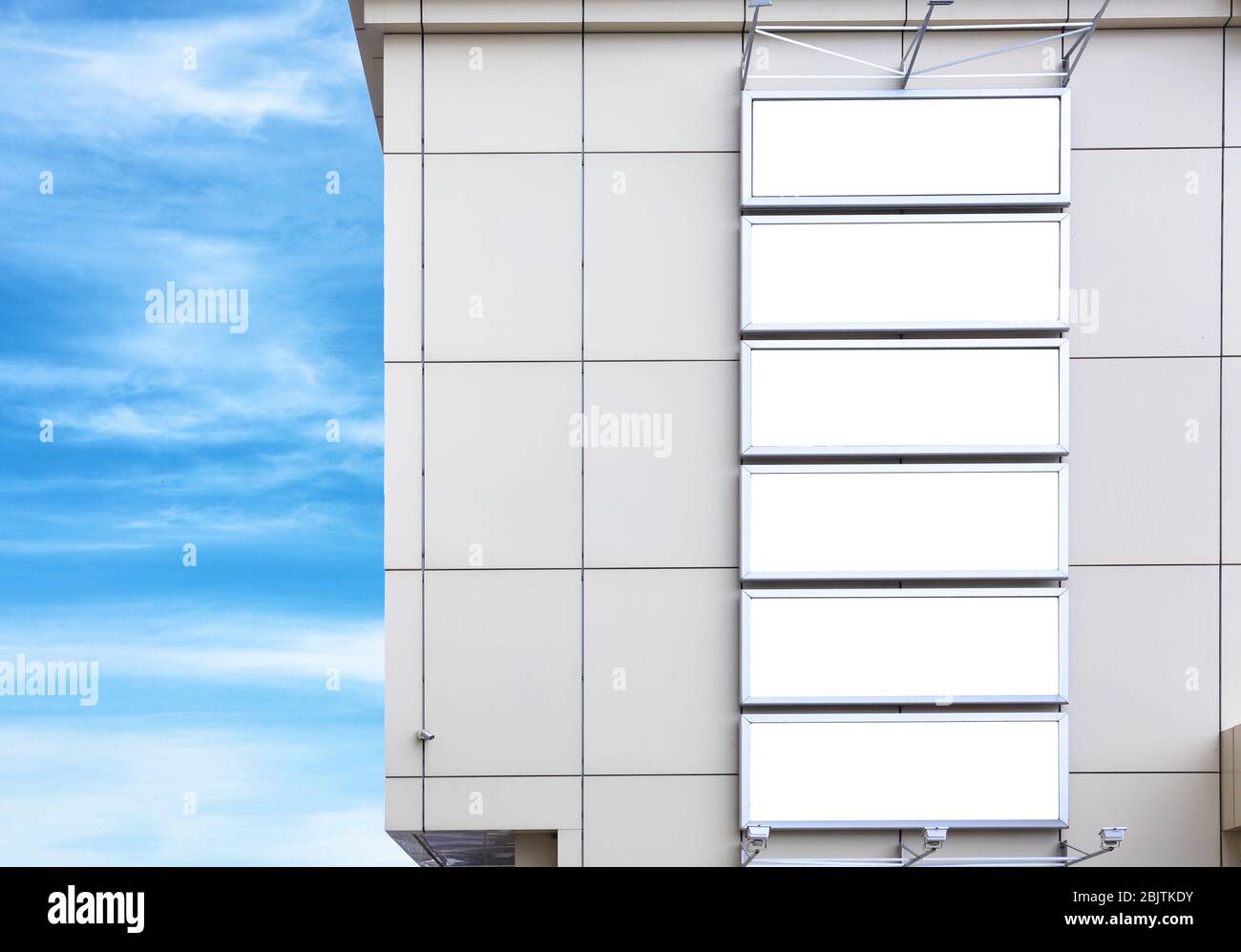 Many blank advertising boards on wall of city building outdoors Stock ...