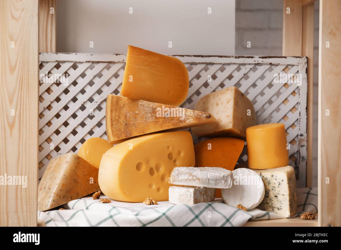 Variety of cheese on storage stand Stock Photo - Alamy