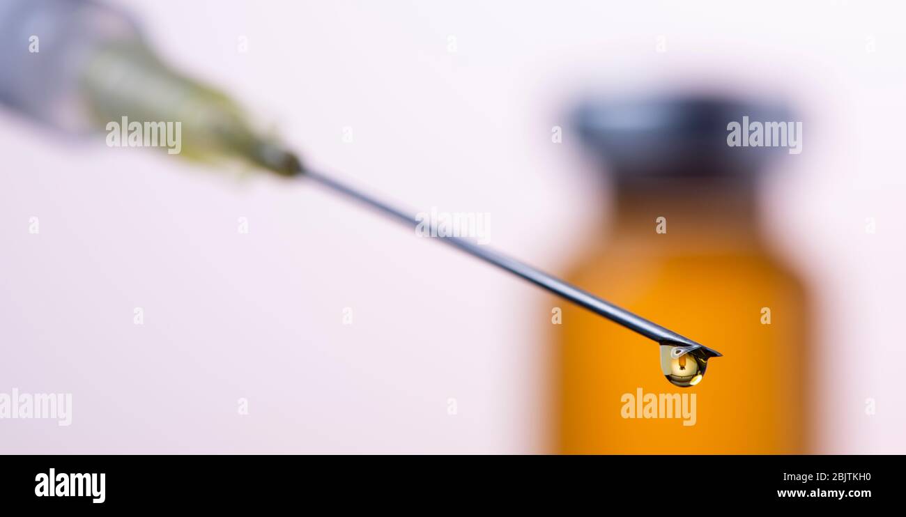 Vaccination with serum and syringe Stock Photo - Alamy