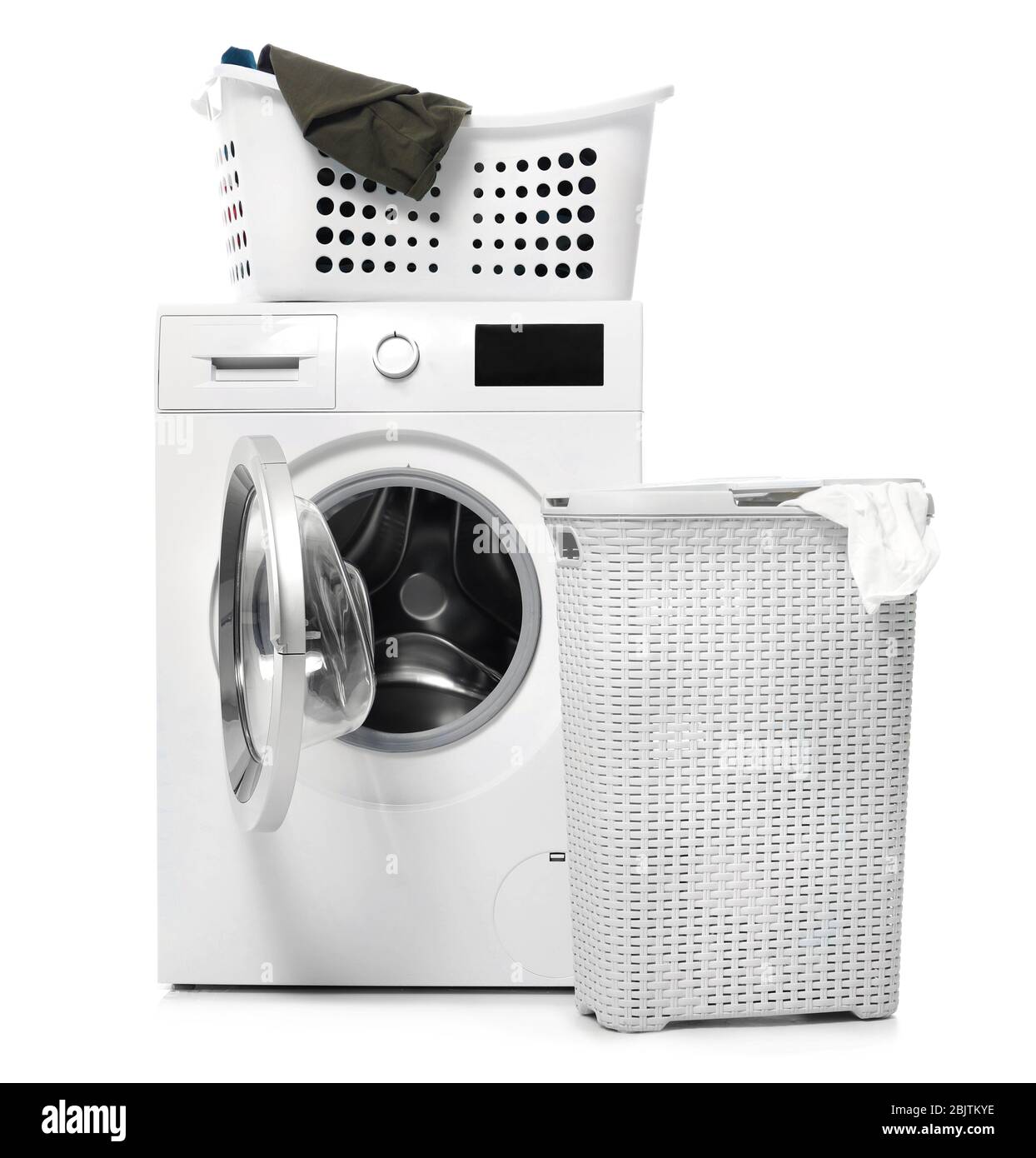 Modern washing machine with laundry on white background Stock Photo - Alamy